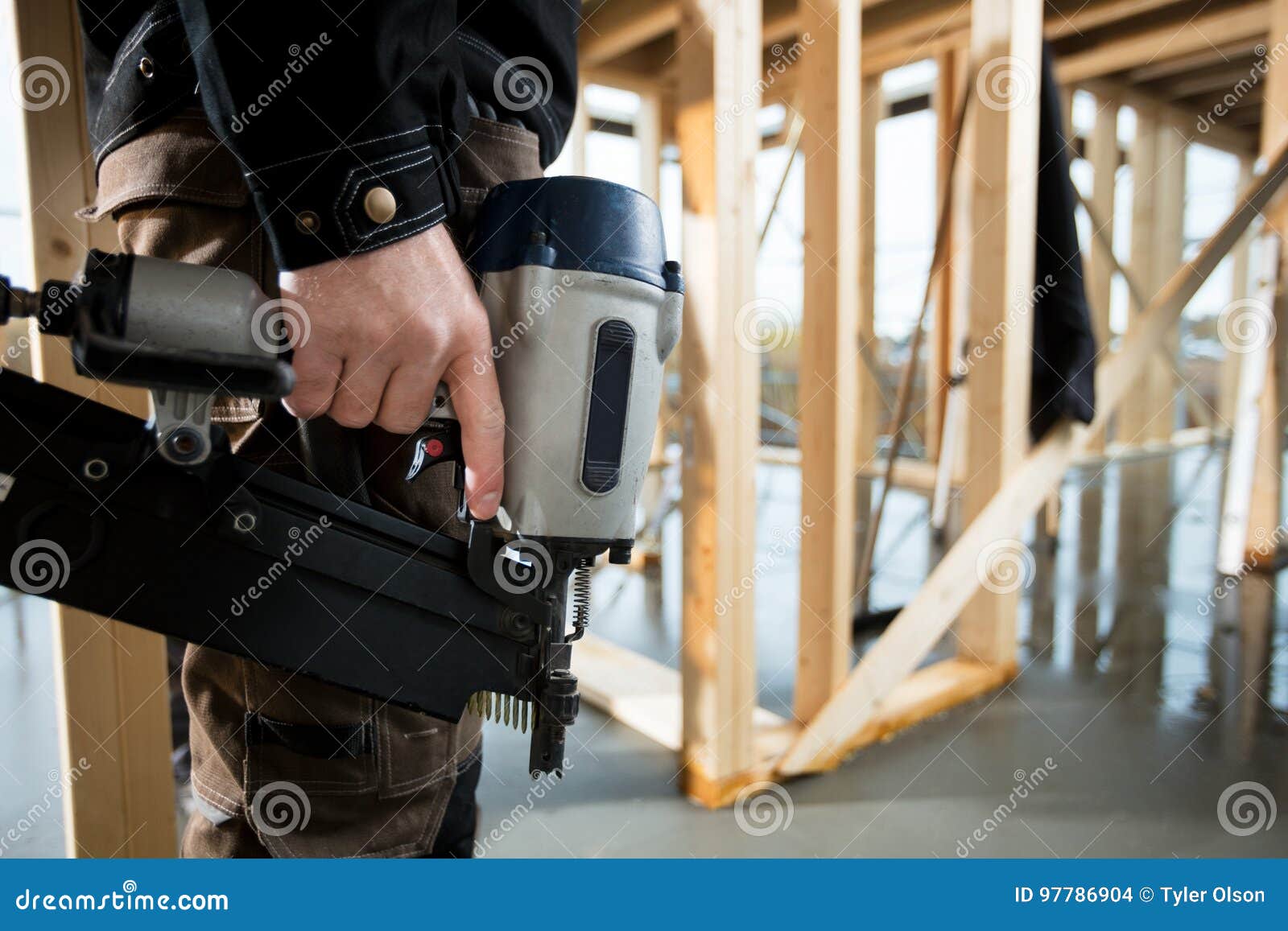 Midsection of Professional Carpenter Holding Drill Machine Stock Photo ...