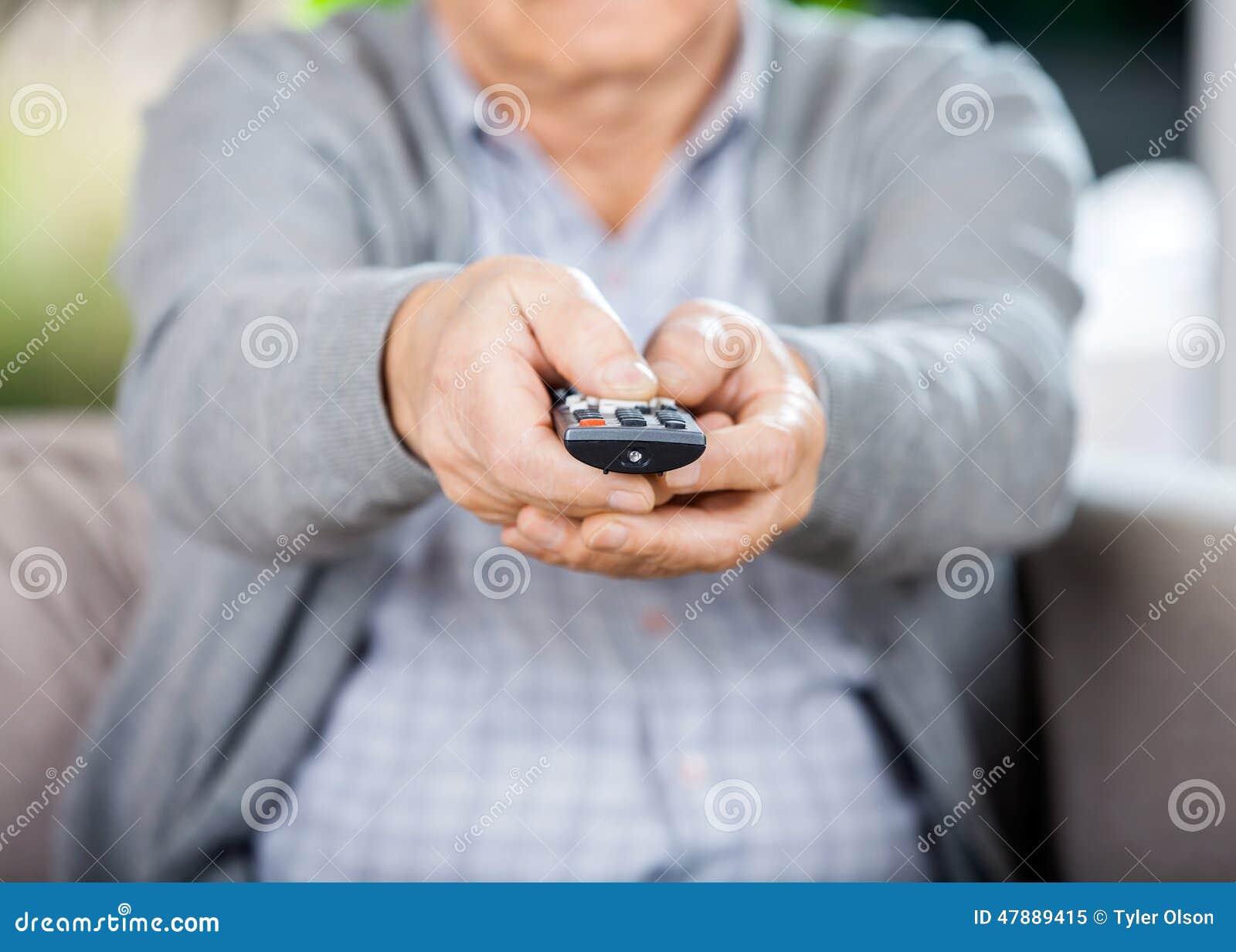 Midsection of Senior Man Holding TV Remote Control Stock Image - Image ...