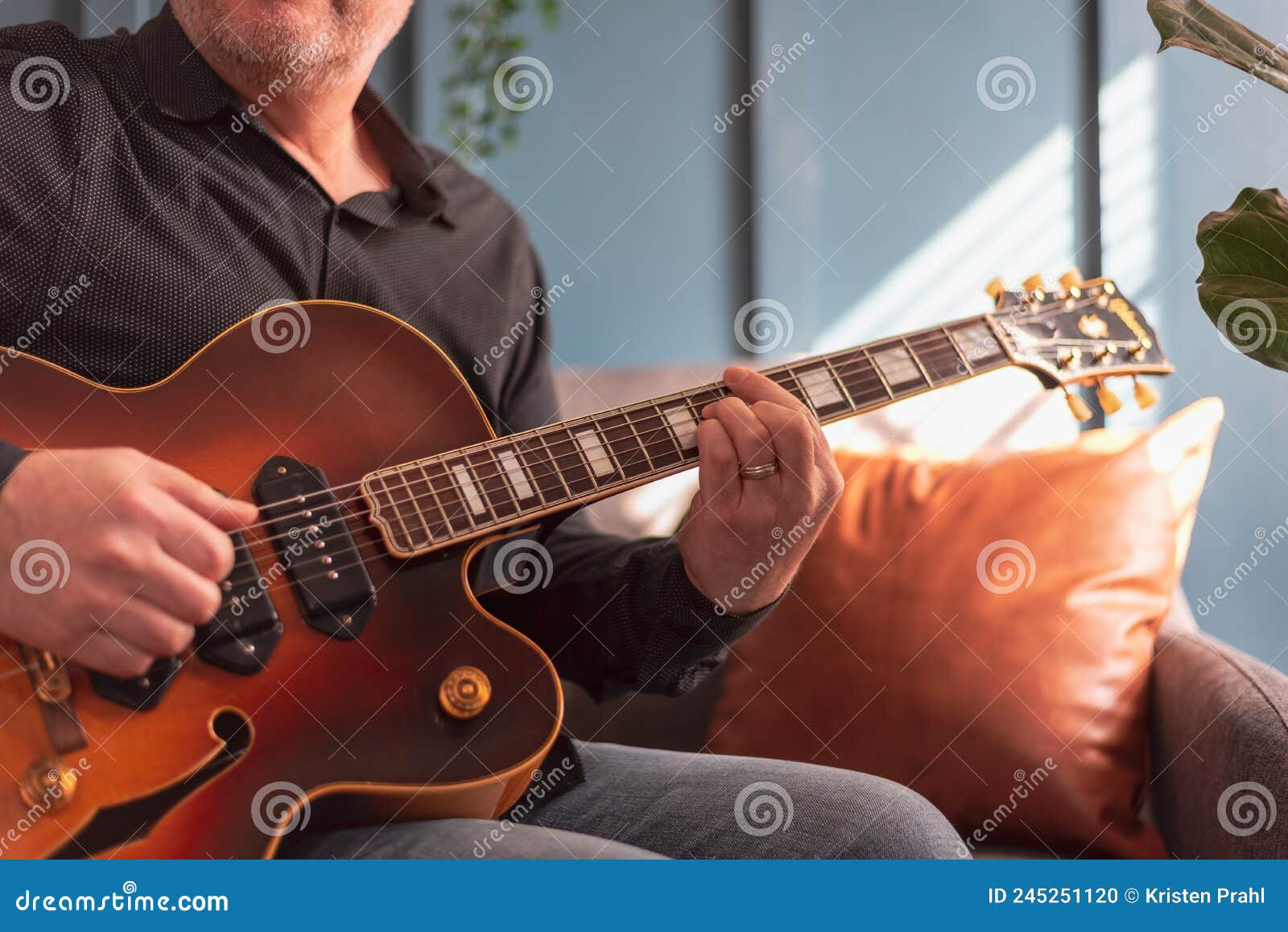 Midsection View of a Man Playing a Vintage Jazz Guitar Stock Photo ...