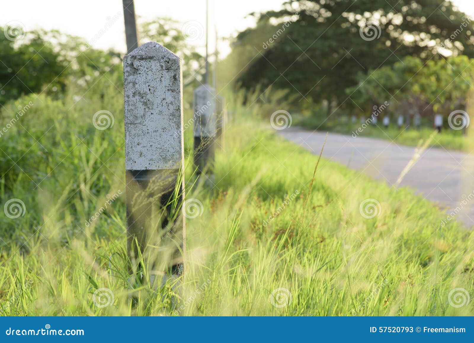 Milestone and Road with Grass Stock Image - Image of background ...