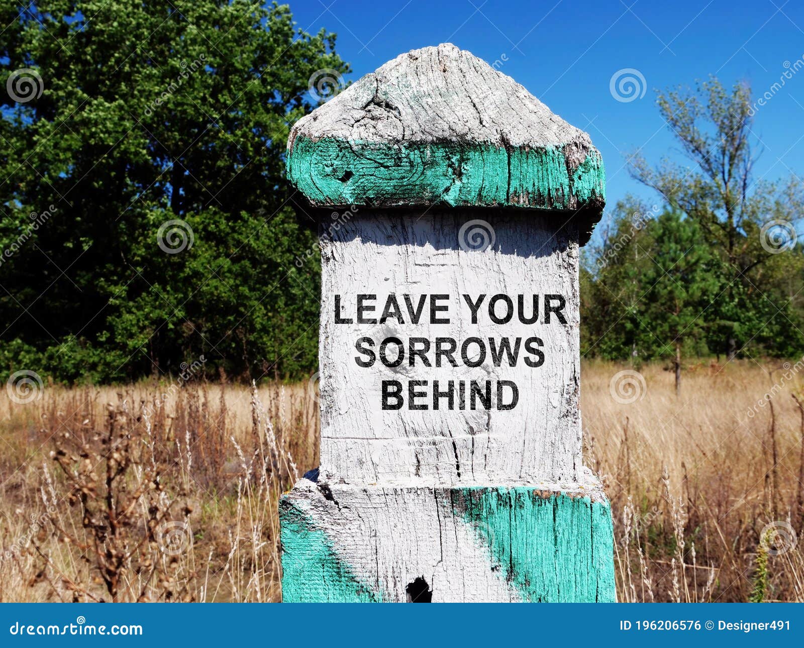 Milestone with Sign Leave Your Sorrows Behind. Stock Photo - Image of ...