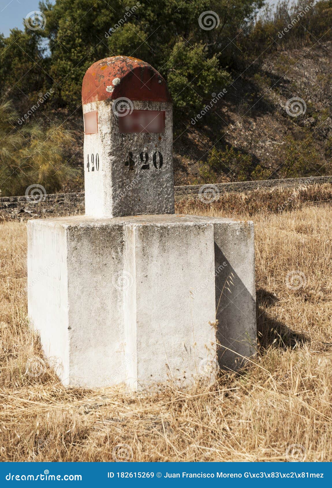Milestone Signaling Marker at the Edge of a Road in White and Red Stock ...