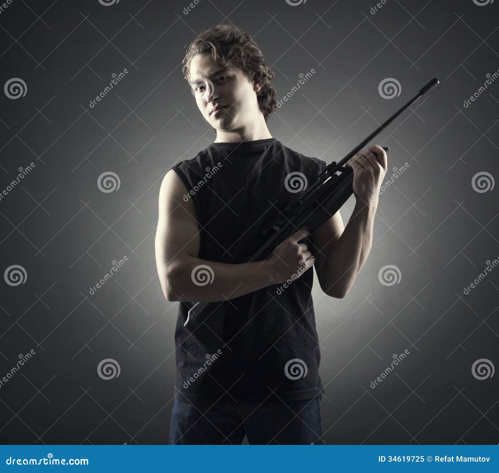 Militant Young Man with a Gun. Stock Image - Image of army, shot: 34619725