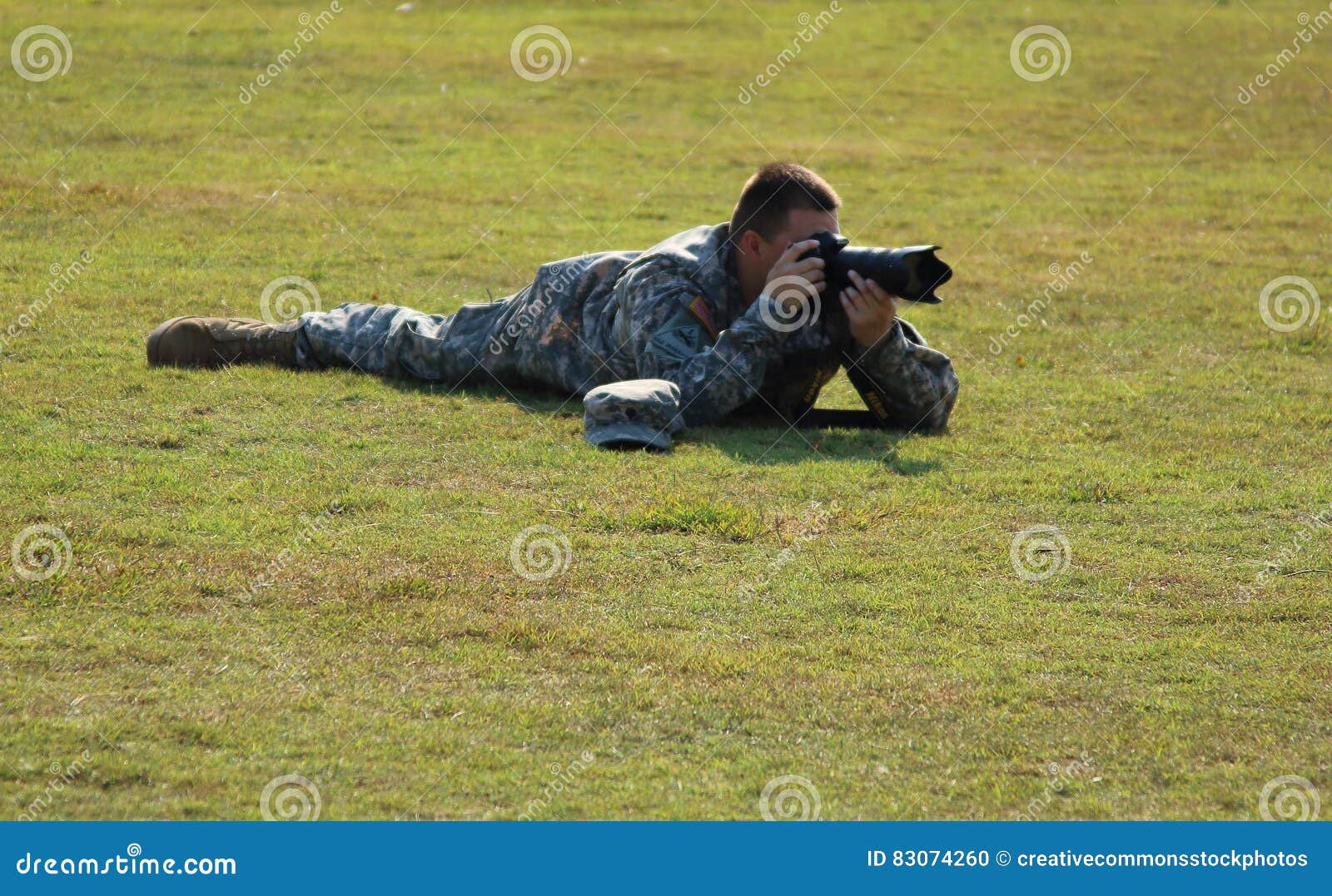 Military Crouching On Green Grass Using Dslr Camera During Daytime ...