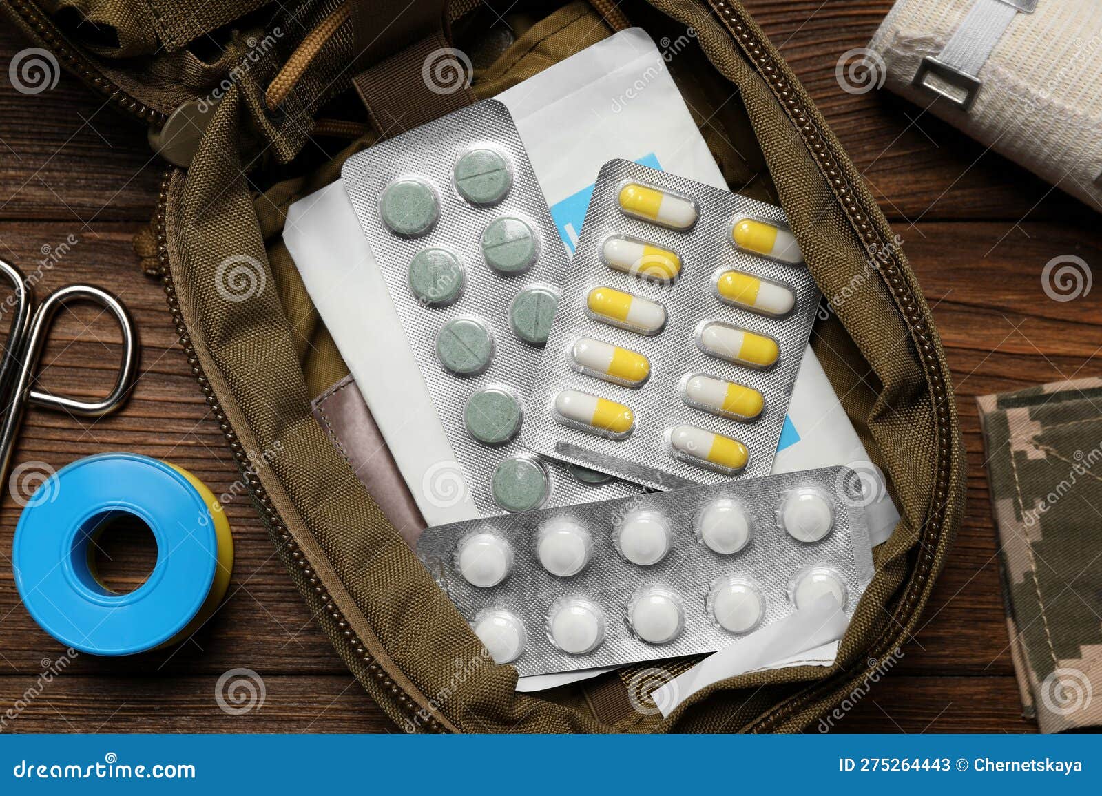 Military First Aid Kit on Wooden Table, Closeup Stock Image - Image of ...