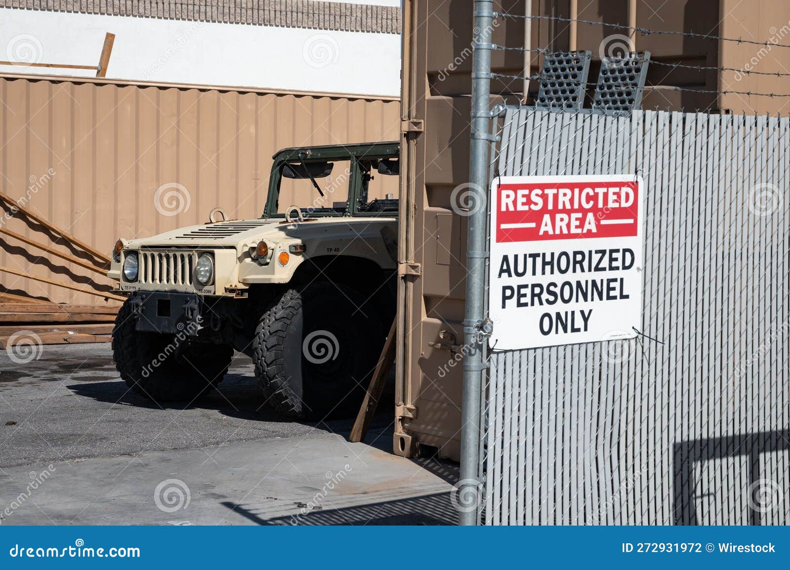 Military-grade Humvee Parked in Front of a Guarded Gate Editorial ...