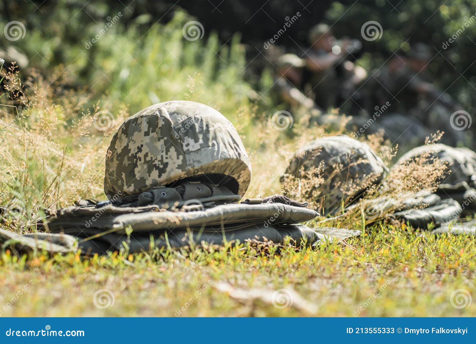 Military Helmets and Bulletproof Vests are Lined Up on the Grass Stock ...