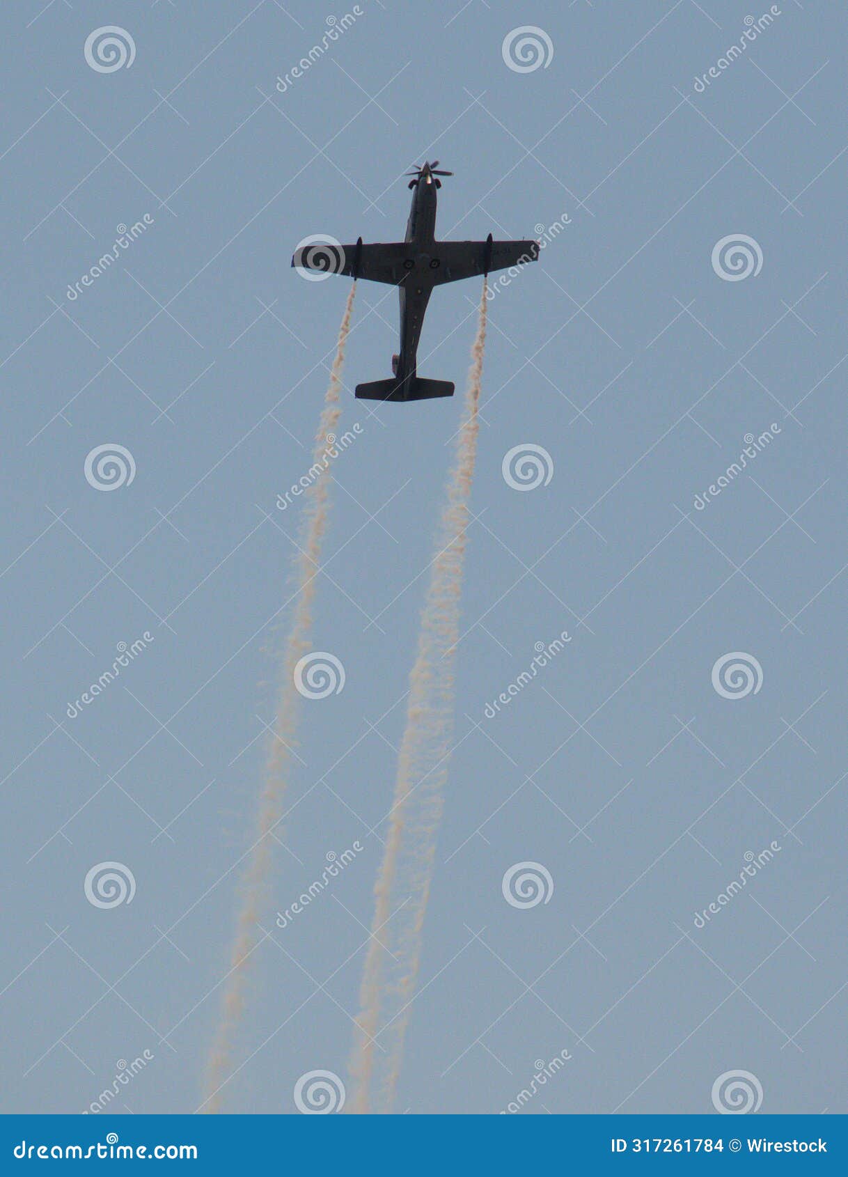 Military Jet Flying with Dual Smoke Trails in the Sky Stock Photo ...