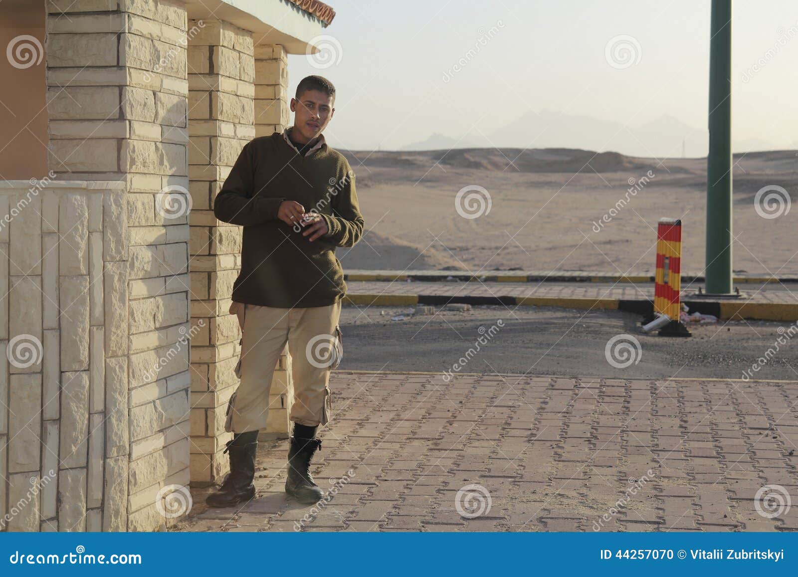 Military man at roadblock editorial image. Image of roadblock - 44257070