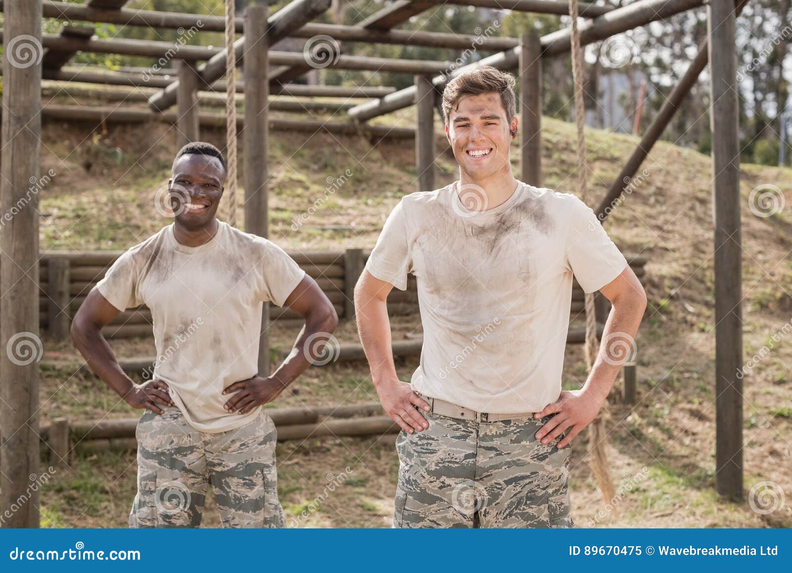Military Man Standing with Hand on Hip during Obstacle Course in Boot ...