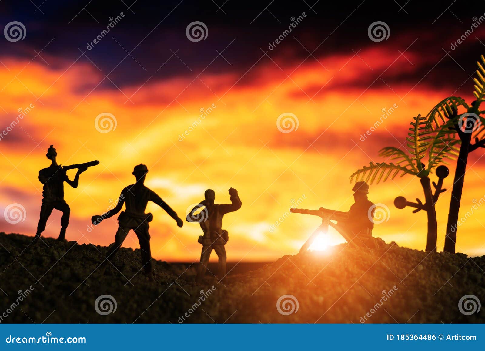 The Military Model is Fighting on the Sand Pile with the Sunset Behind ...