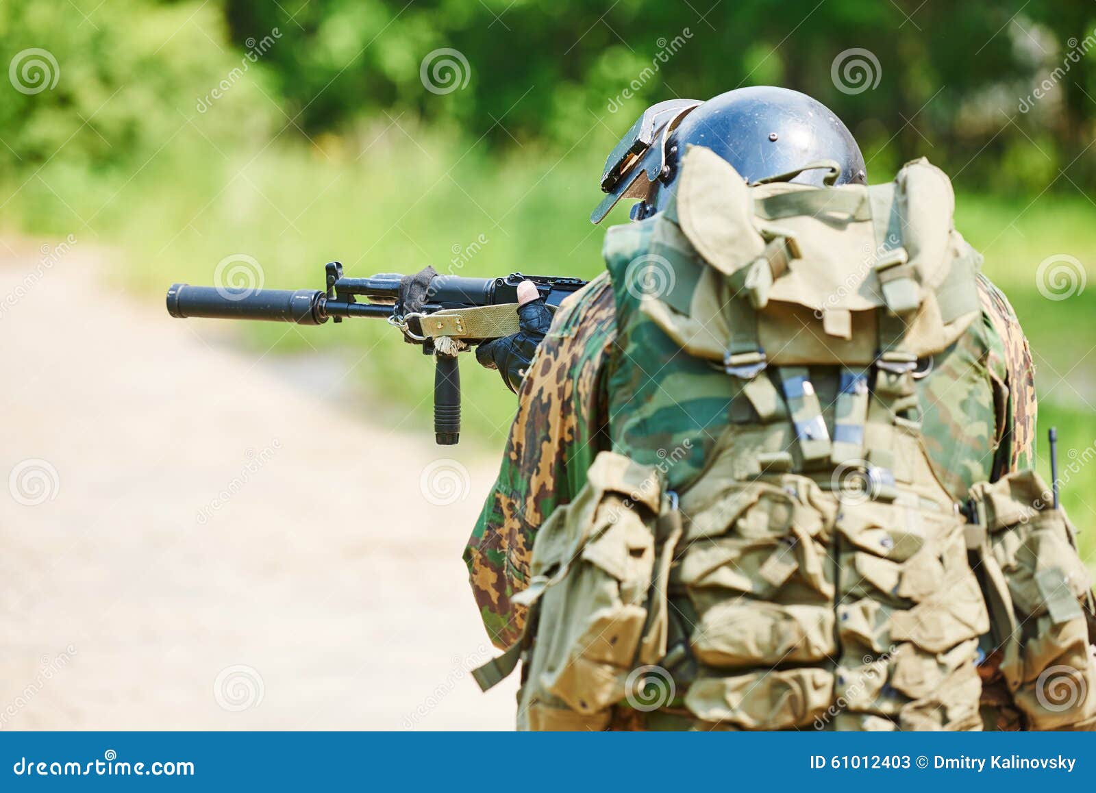 Soldier With An Assault Rifle Wearing A Tactical Load-carrying Vest ...