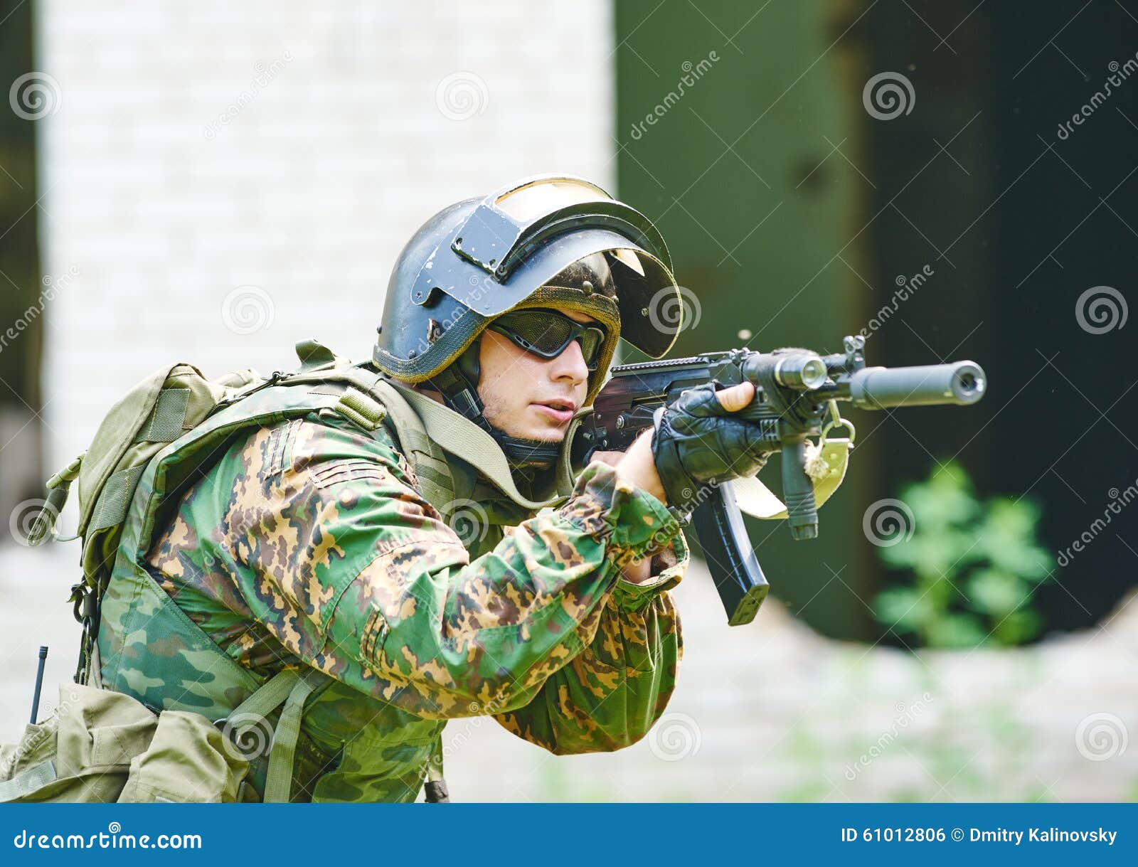 Soldier With An Assault Rifle Wearing A Tactical Load-carrying Vest ...
