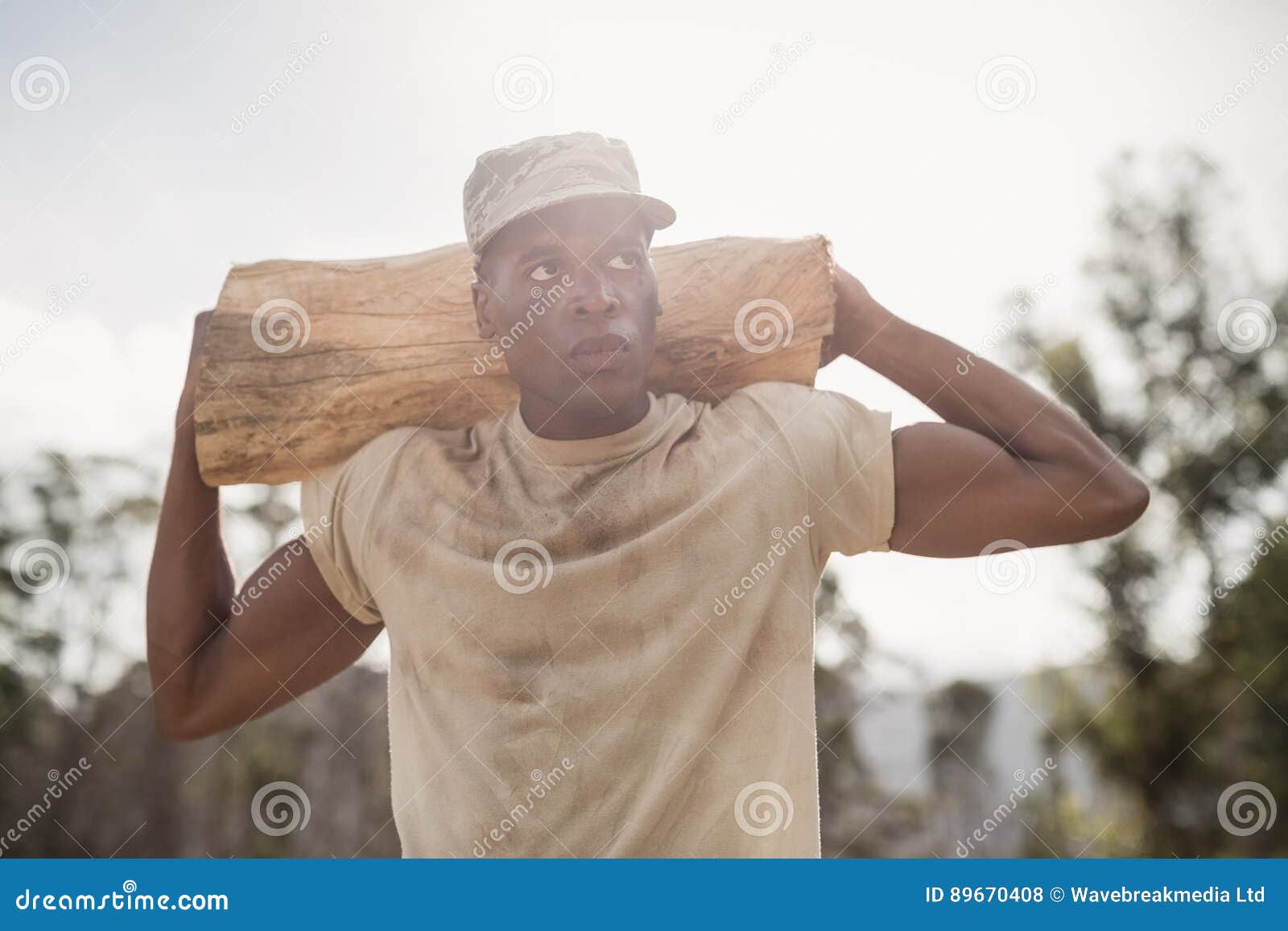 Military Soldier Carrying a Tree Log during Obstacle Course Stock Photo ...