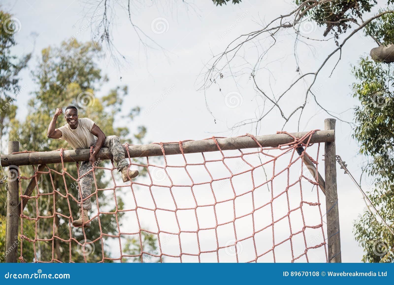 Military Soldier Climbing Net during Obstacle Course Stock Photo ...