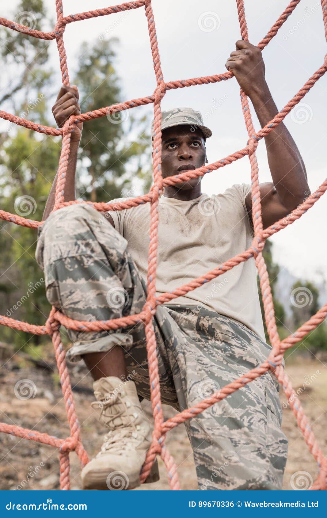 Military Soldier Climbing a Net during Obstacle Course Stock Photo ...