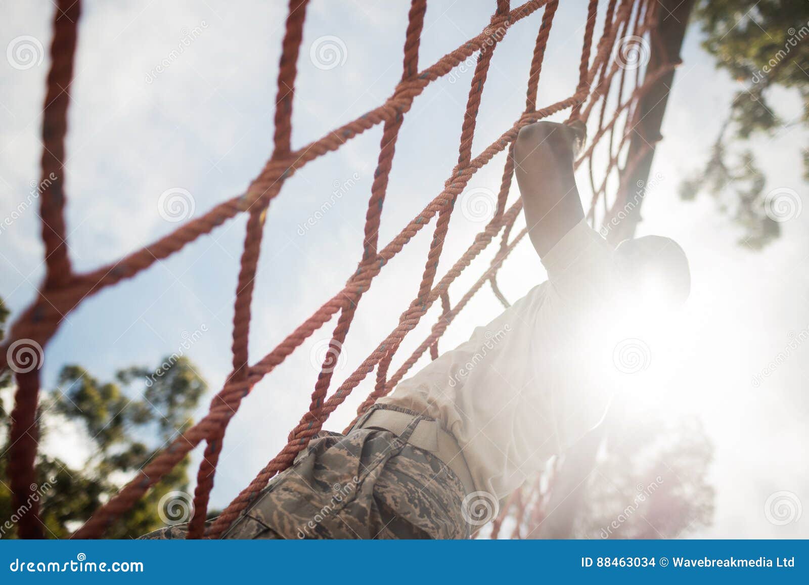 Military Soldier Climbing Rope during Obstacle Course Stock Photo ...