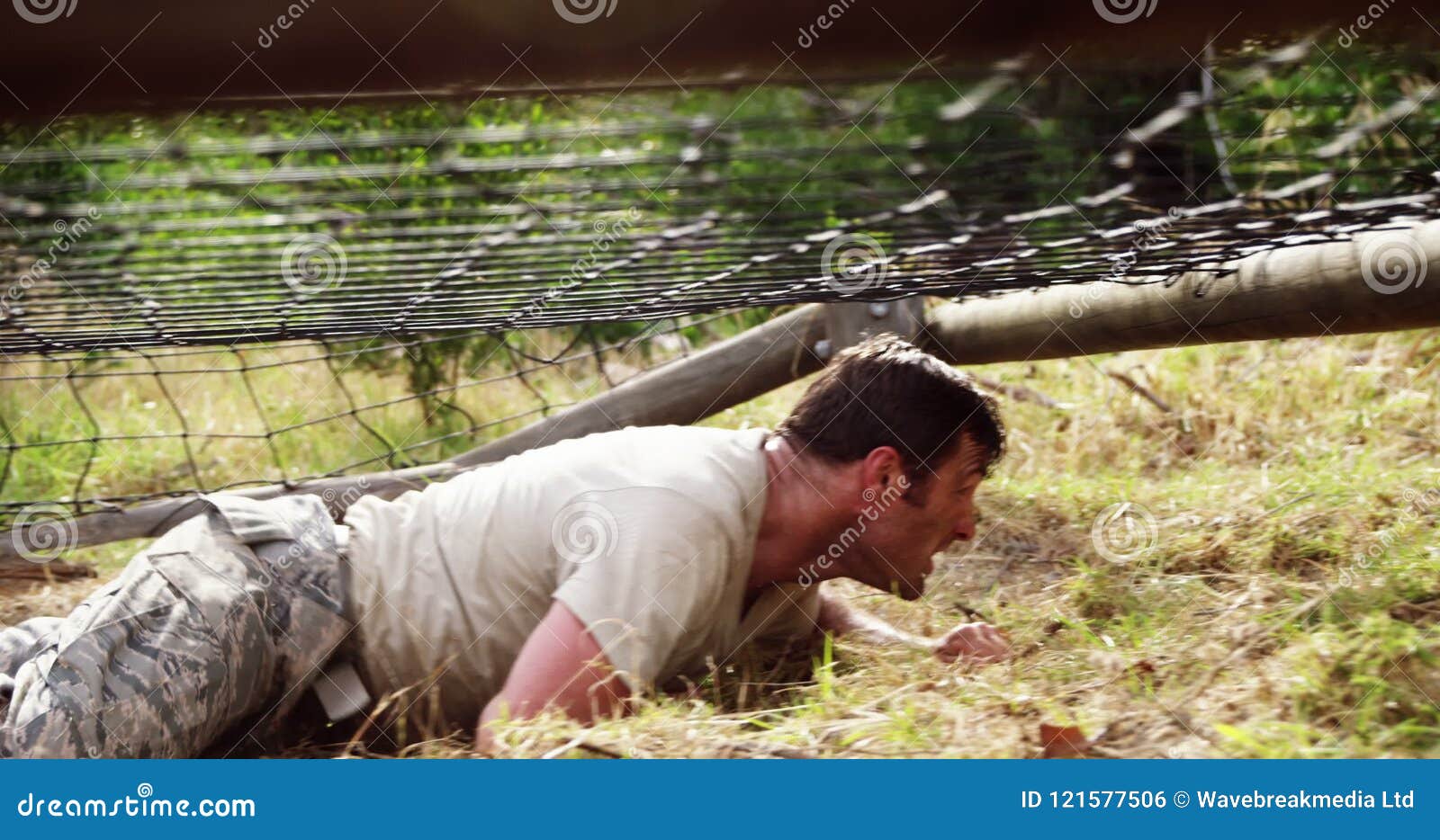 Military Soldier Crawling Under the Net during Obstacle Course 4k Stock ...