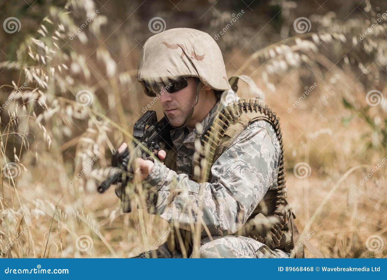 Military Soldier Hiding in Grass while Guarding with a Rifle Stock ...