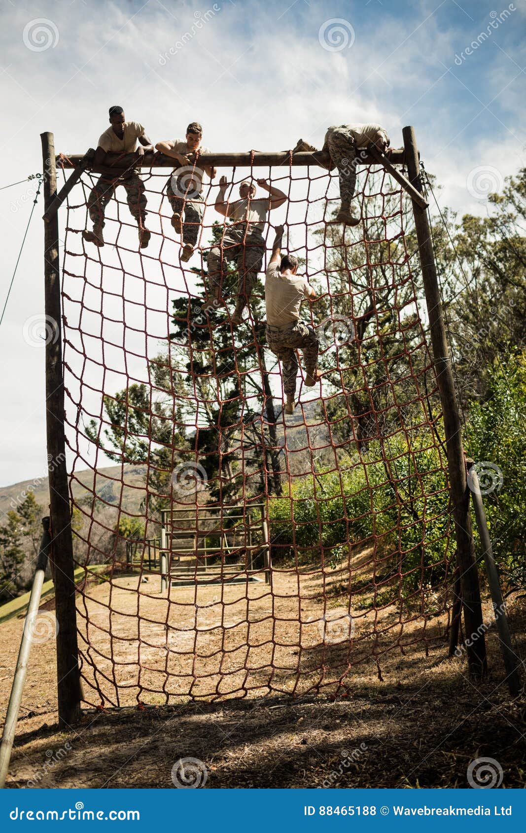 Military Soldiers Climbing Rope during Obstacle Course Stock Photo ...