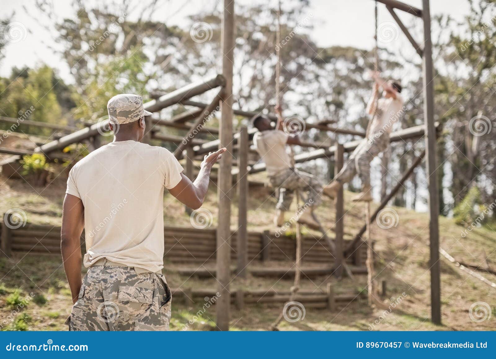 Military Soldiers Climbing Rope during Obstacle Course Training Stock ...