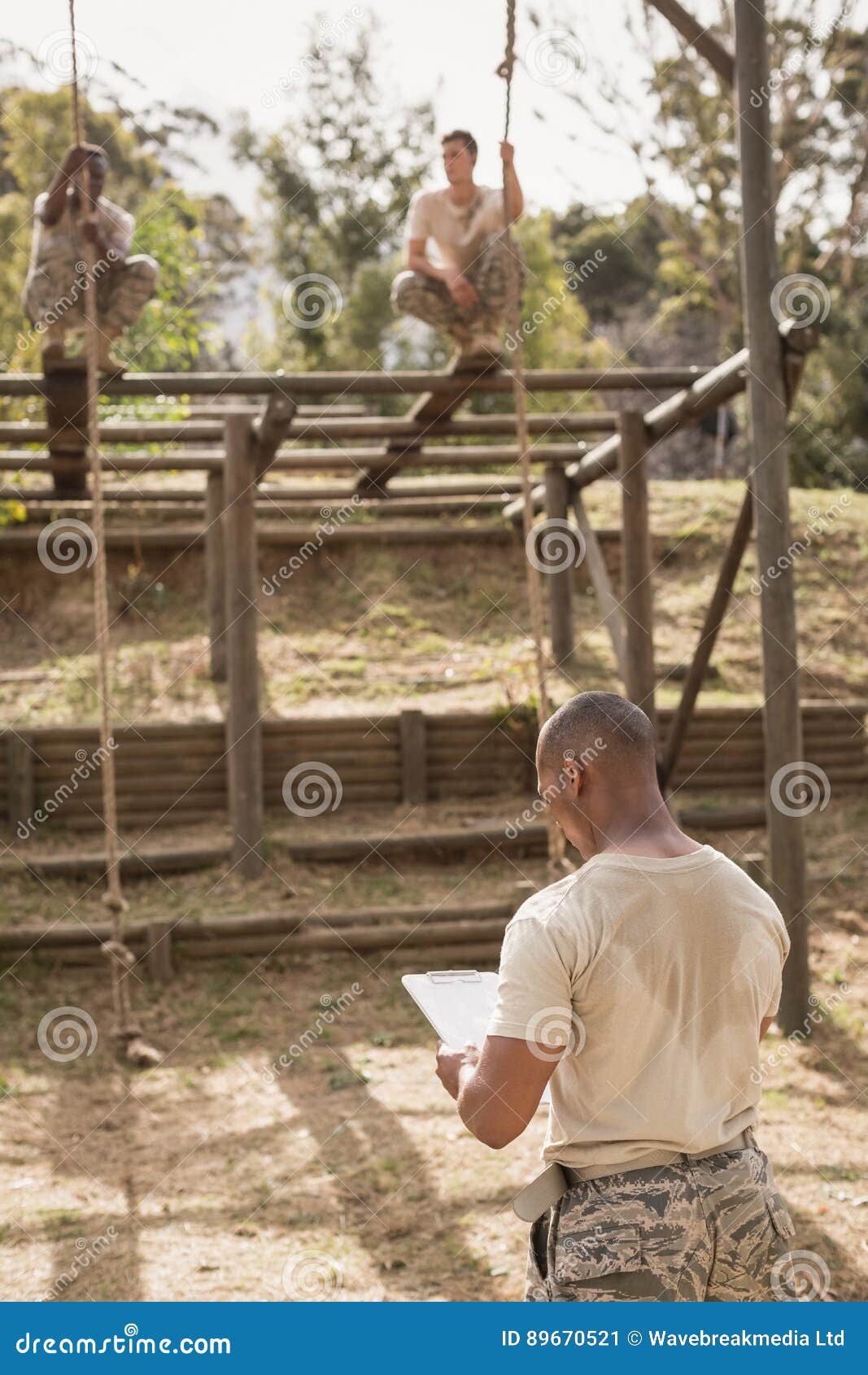 Military Soldiers Climbing Rope during Obstacle Course Training Stock ...