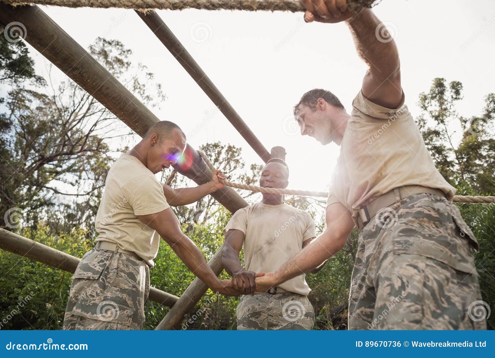 Military Soldiers with Hands Stacked during Obstacle Training Stock ...