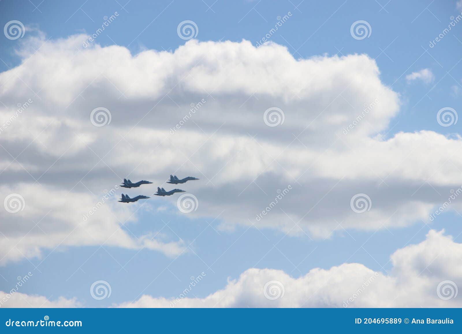 4 Military Spitfire Fighters Silhouettes in Blue Sky with White Clouds ...