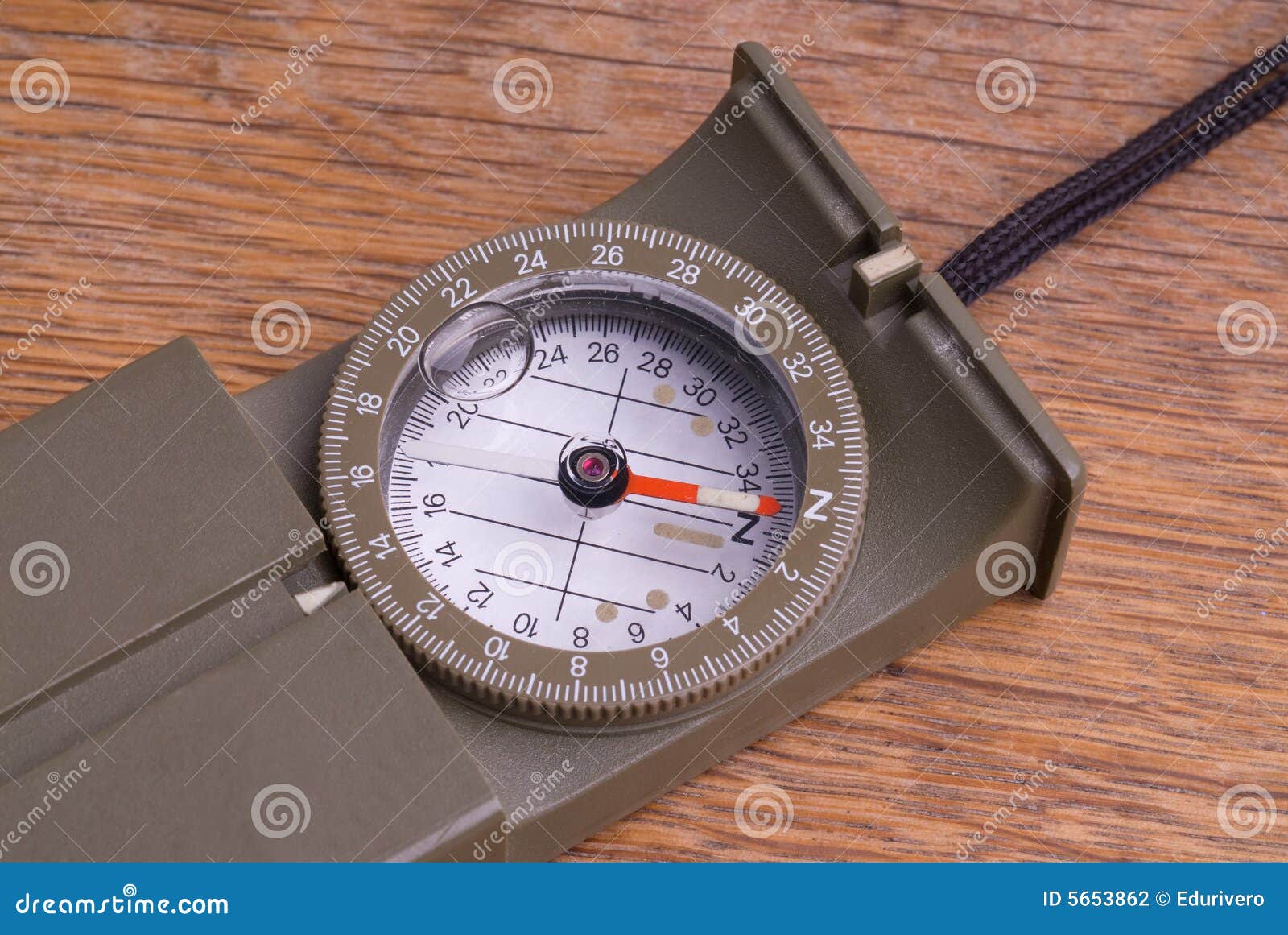 Military Style Compass on a Wooden Table Stock Photo - Image of arrow ...