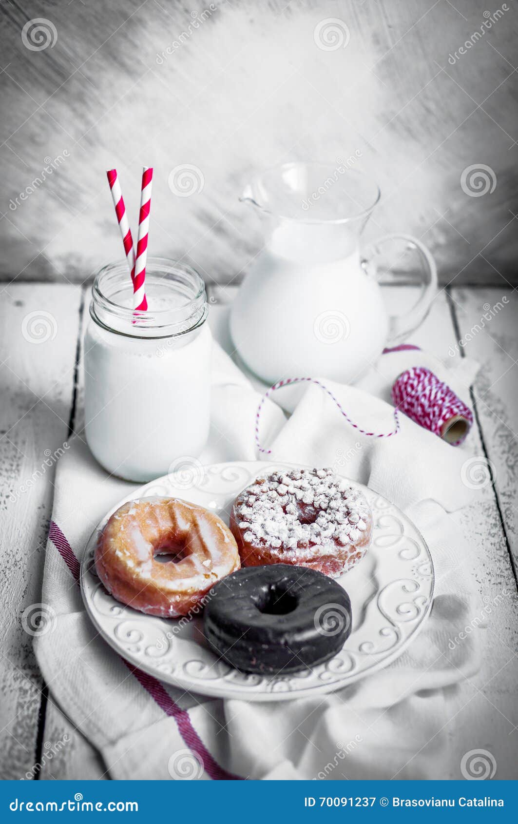 Milk and Assorted Donuts on Rustic Wooden Background Stock Image ...