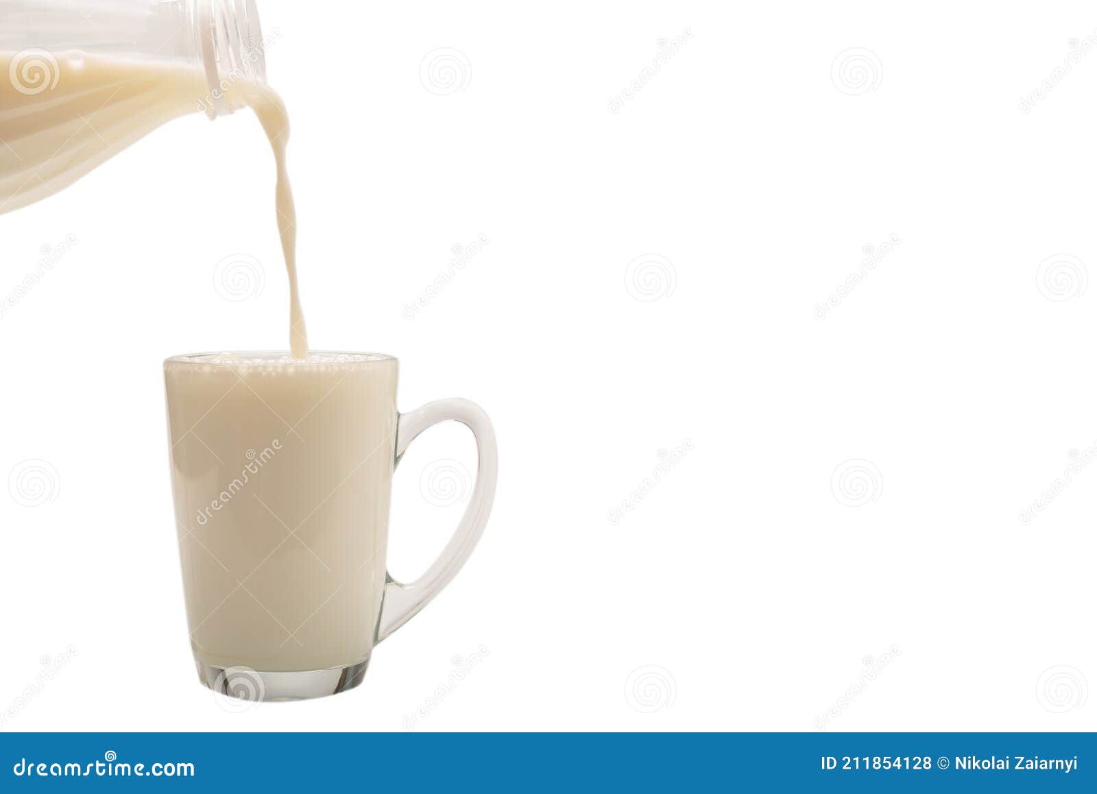 Milk is Being Poured from a Bottle into a Cup Stock Photo - Image of ...