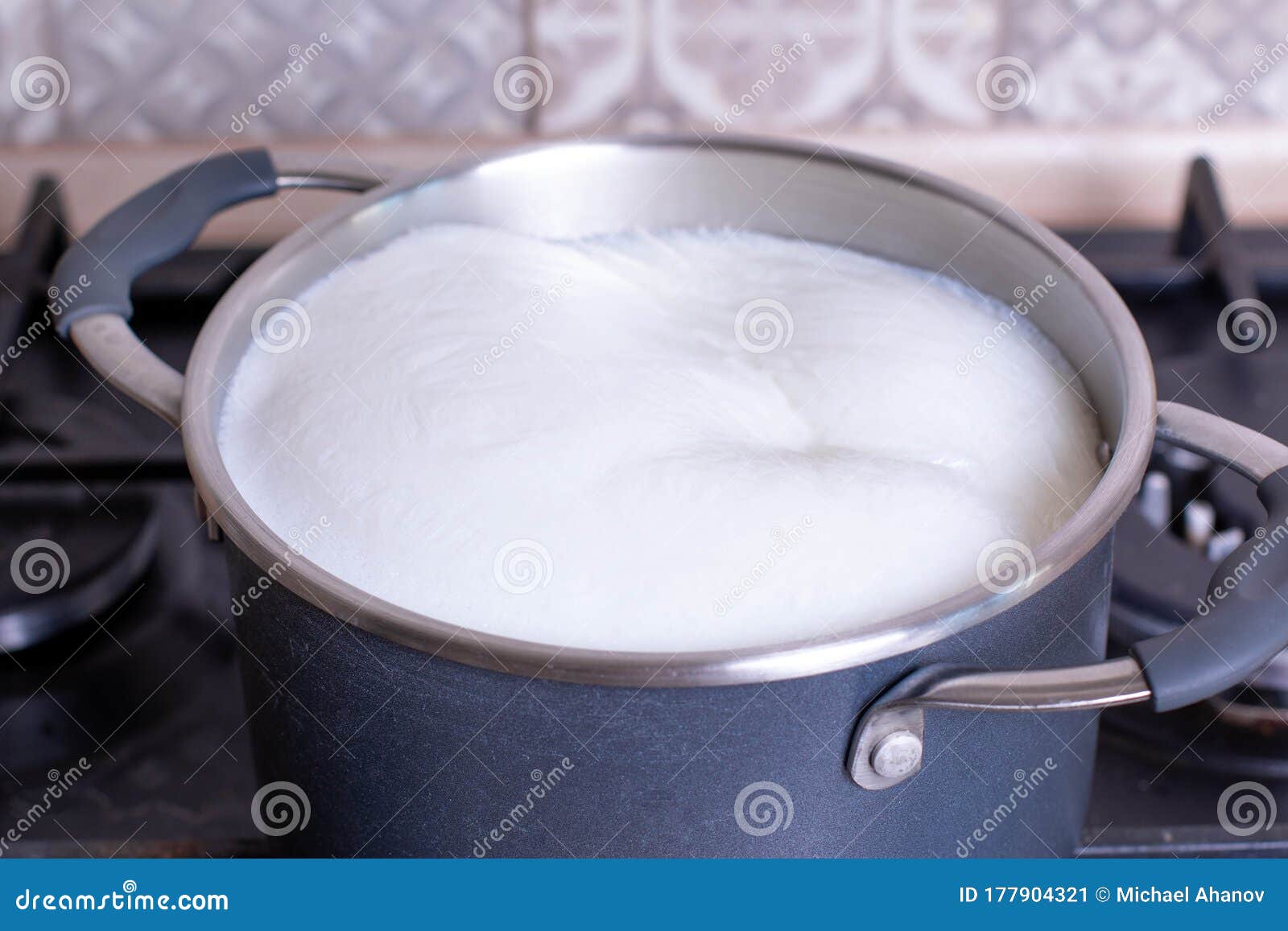 Milk boiling over a pan stock image. Image of drink - 177904321