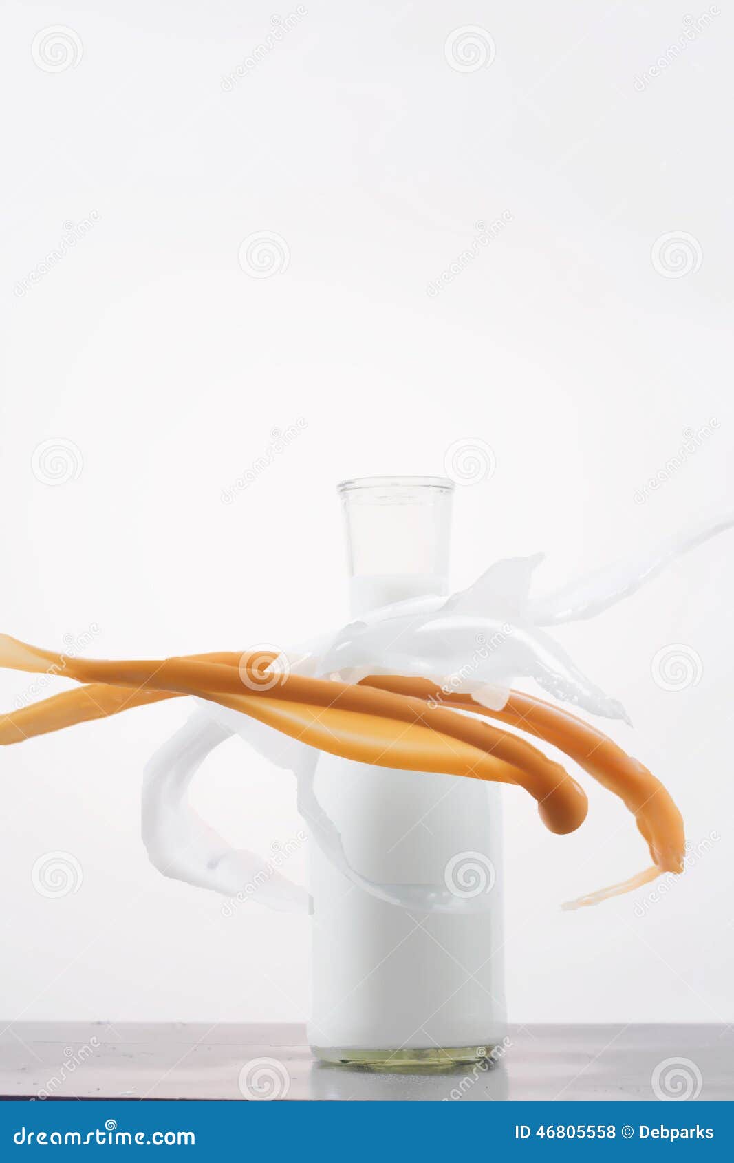Milk Bottle with Milk Being Splashed with White and Chocolate Milk ...