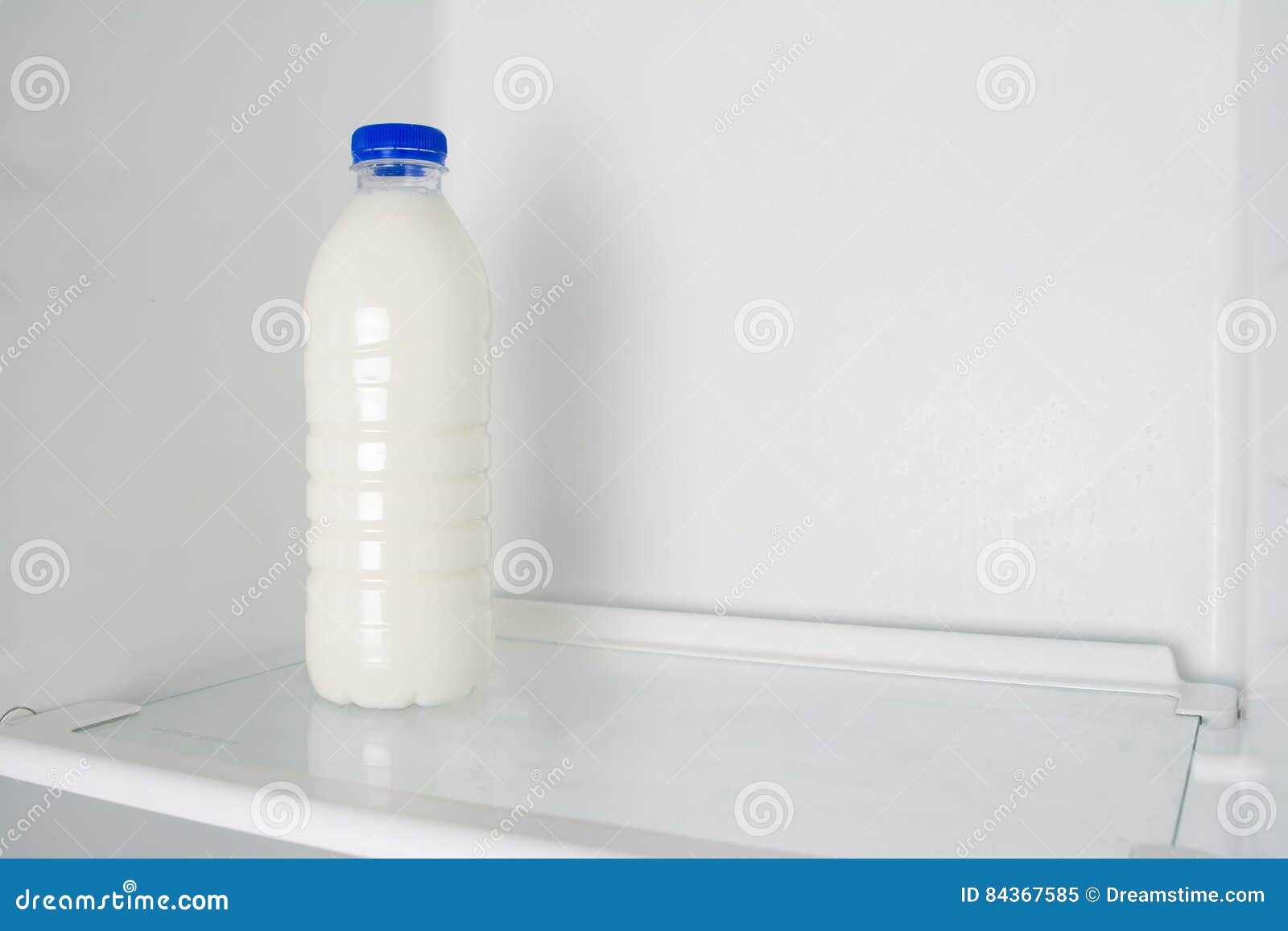 Milk in an empty fridge. stock image. Image of food, extra - 84367585