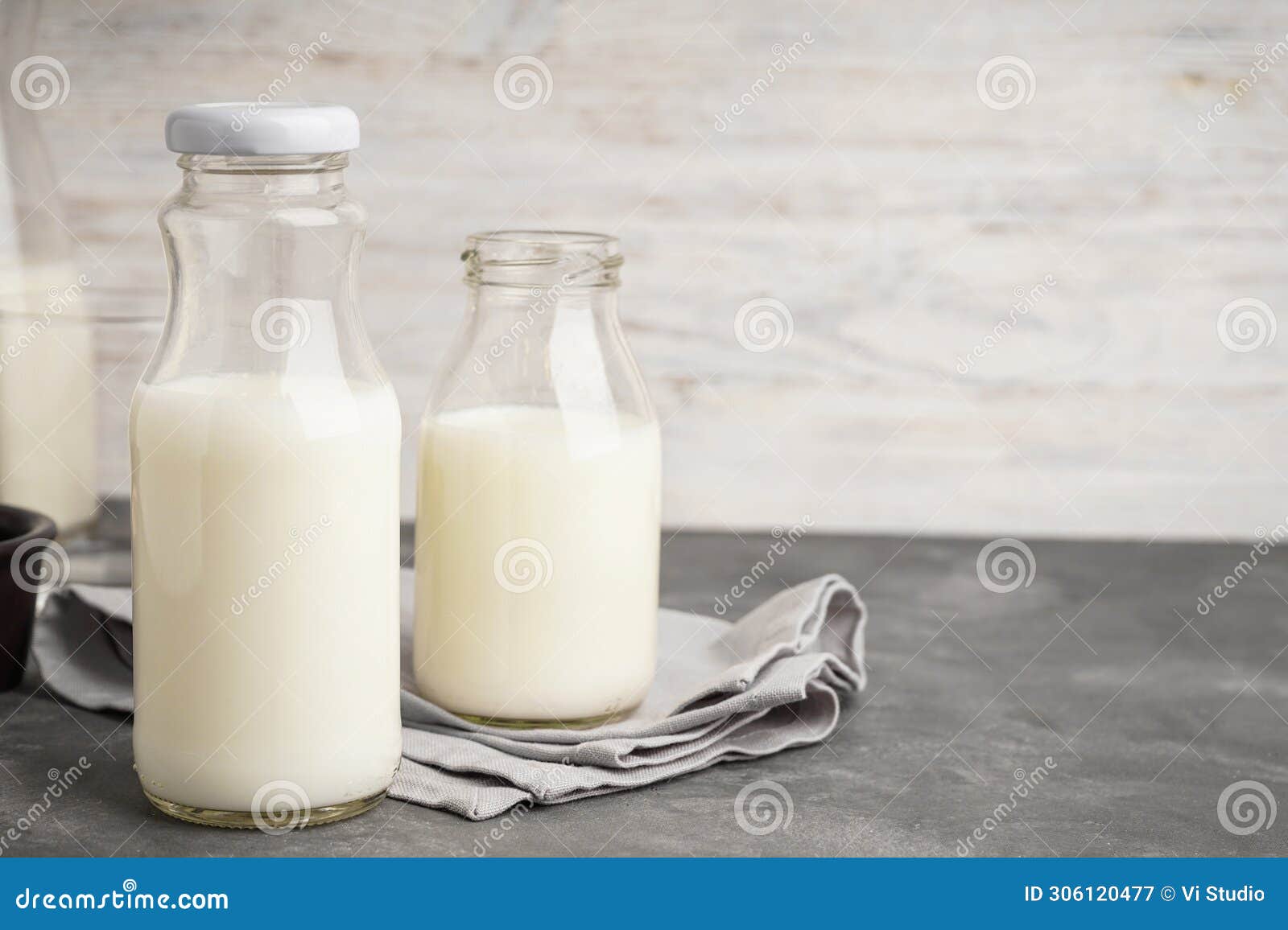 Milk in Jar and Glass on the Grey Background Stock Image - Image of ...