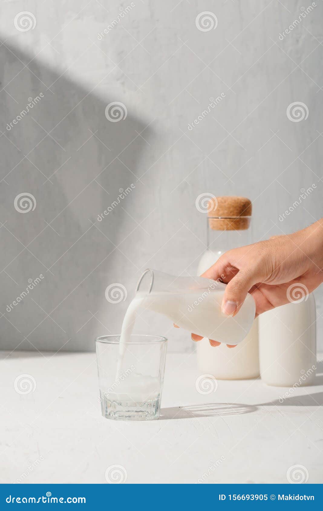 Milk from a Jug Pouring into Glass Stock Image - Image of closeup ...