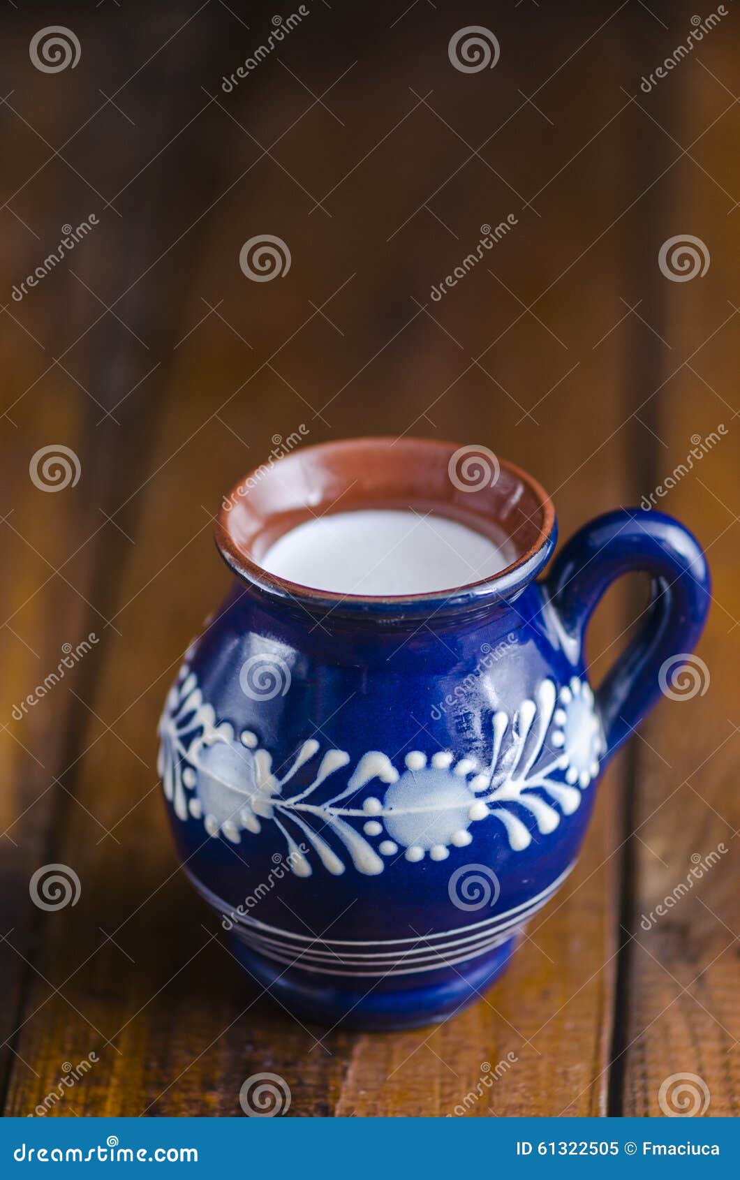Milk in a rustic cup stock image. Image of rustic, food - 61322505