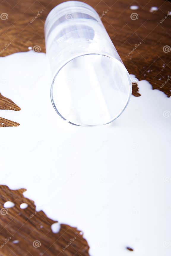 Milk spilled from glass stock image. Image of drink, wooden - 29266151