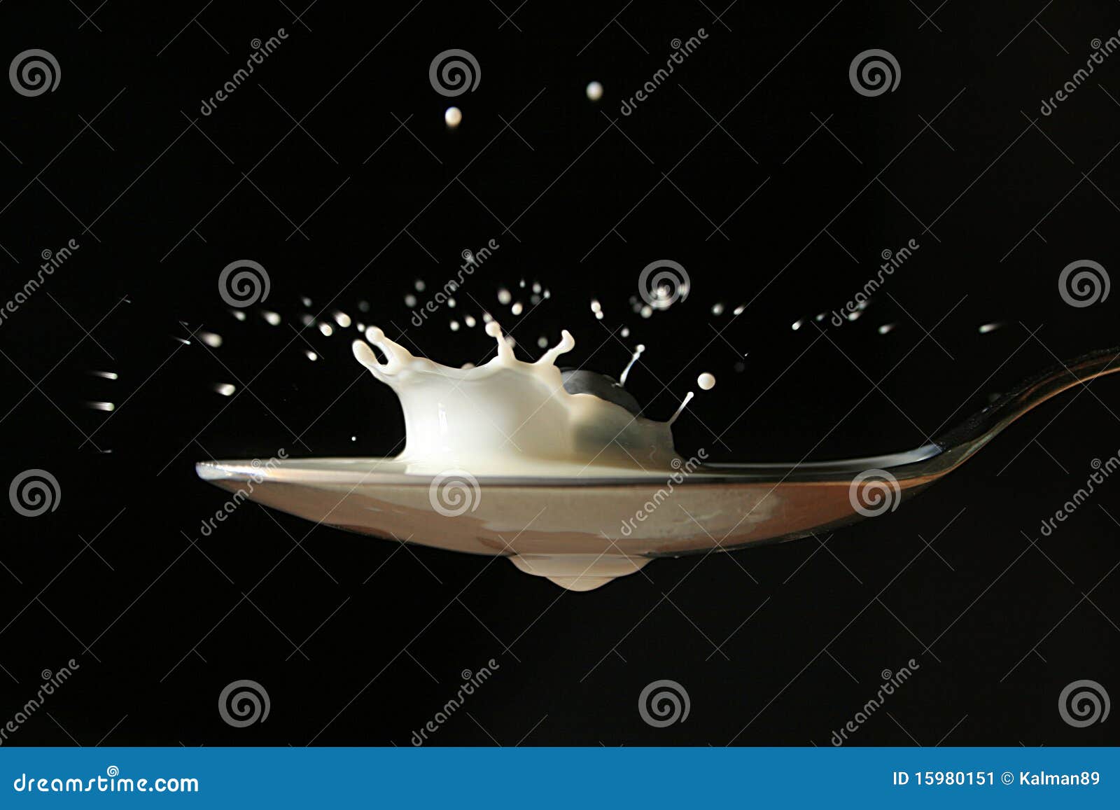 Milk splash in the spoon stock image. Image of milk, dairy - 15980151