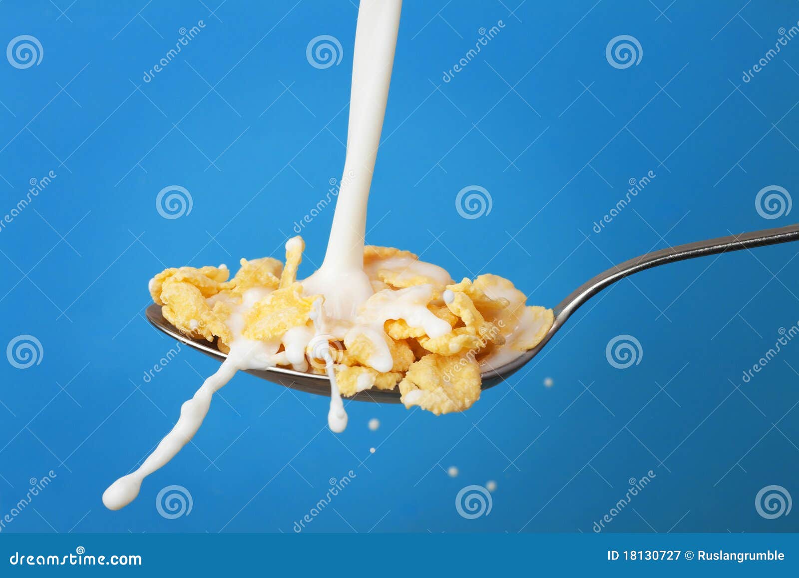 Milk Splashing into Spoon with Cornflakes Stock Image - Image of ...