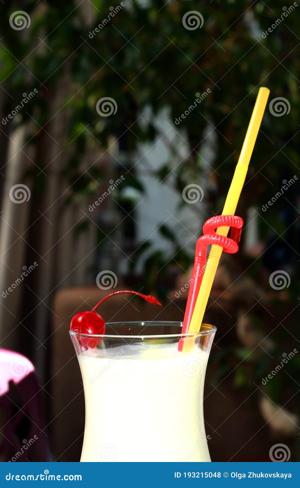 A Milkshake with a Red Straw and a Cherry in the Fresh Air Stock Photo ...