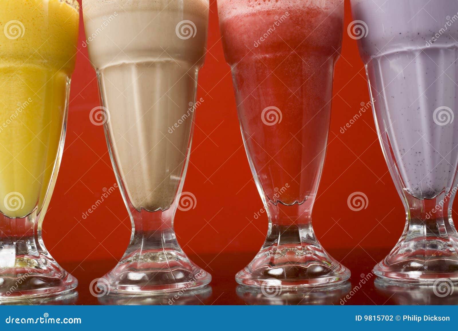 Four Milkshakes On The Background Of Blue Wall Royalty-Free Stock ...