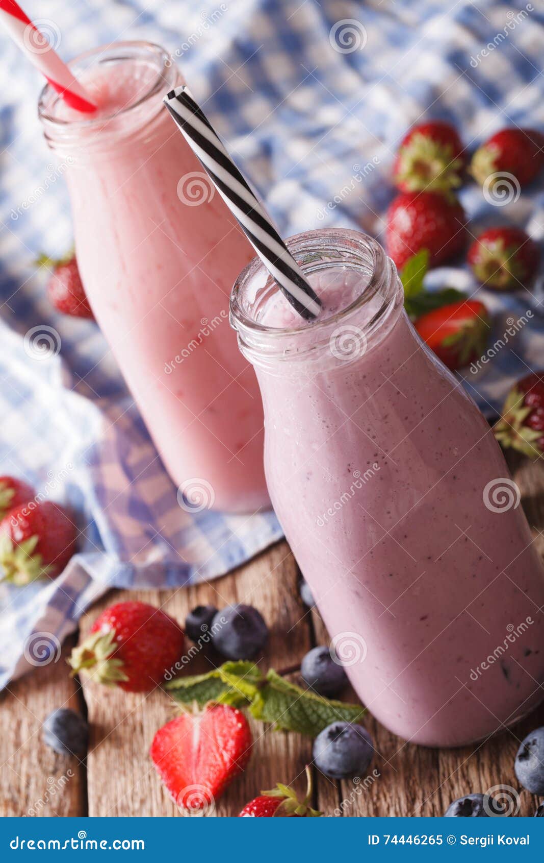 Milkshakes with Strawberries and Blueberries in Bottles Close-up ...