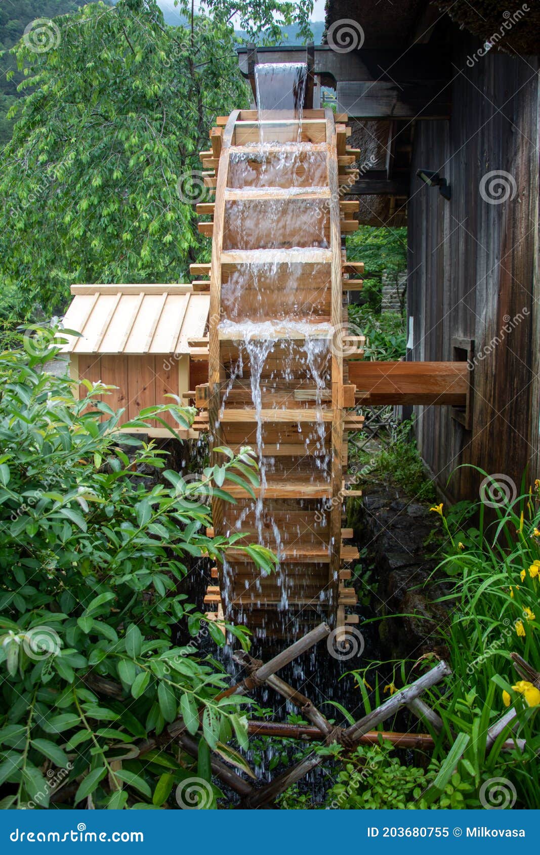 The Mill Wheel Rotates Under a Stream of Water Stock Image - Image of ...