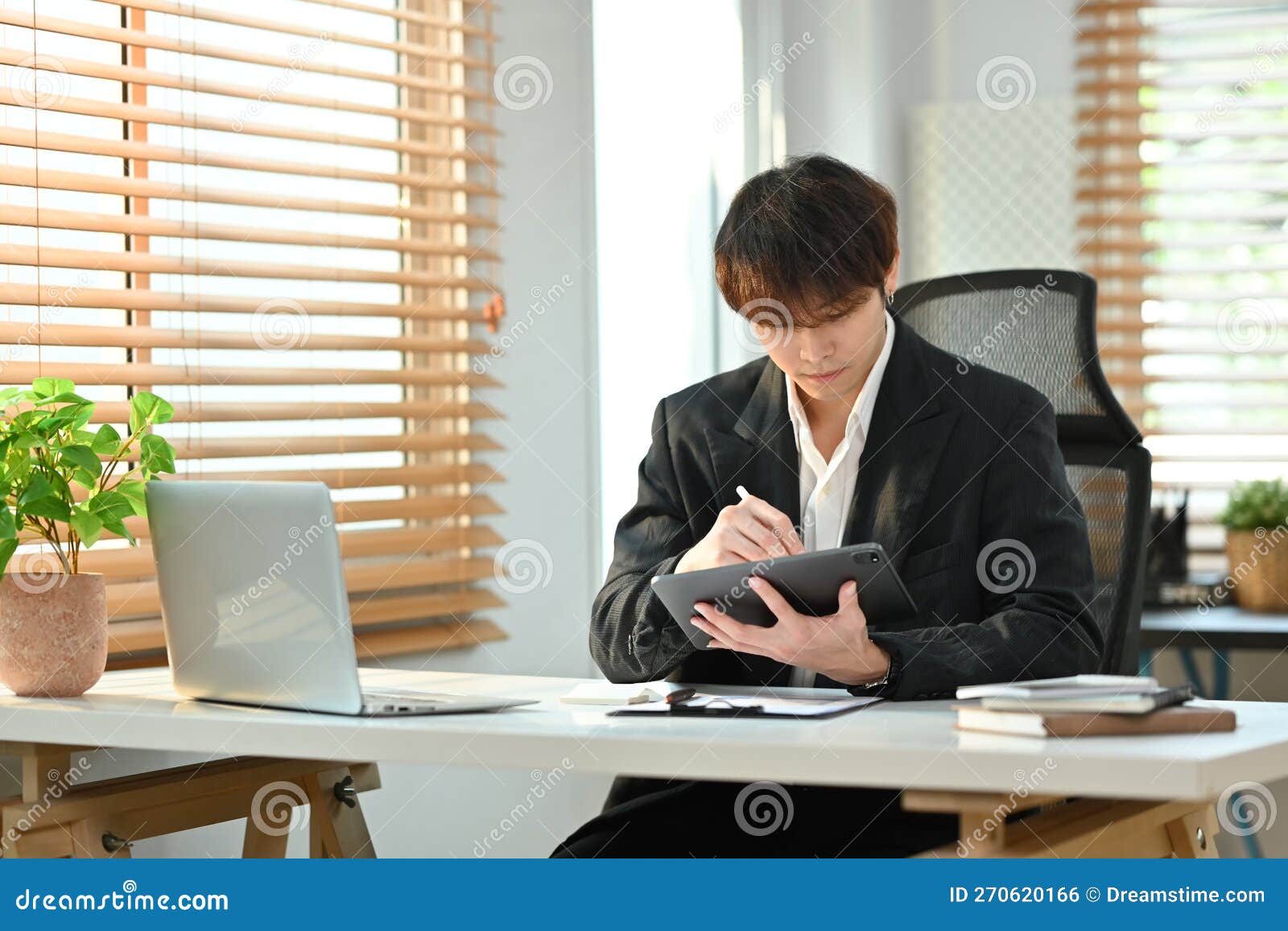 Millennial Asian Man Finance Manager Planning Work Projects Using ...