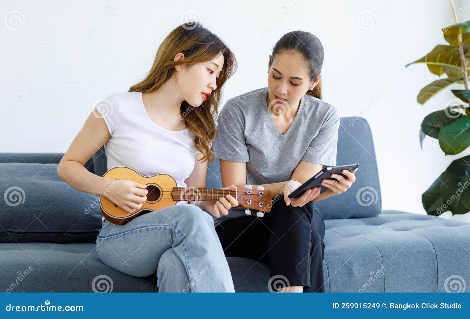 Millennial Asian Young Happy Female Lesbian Lgbtq Lover Couple Sitting