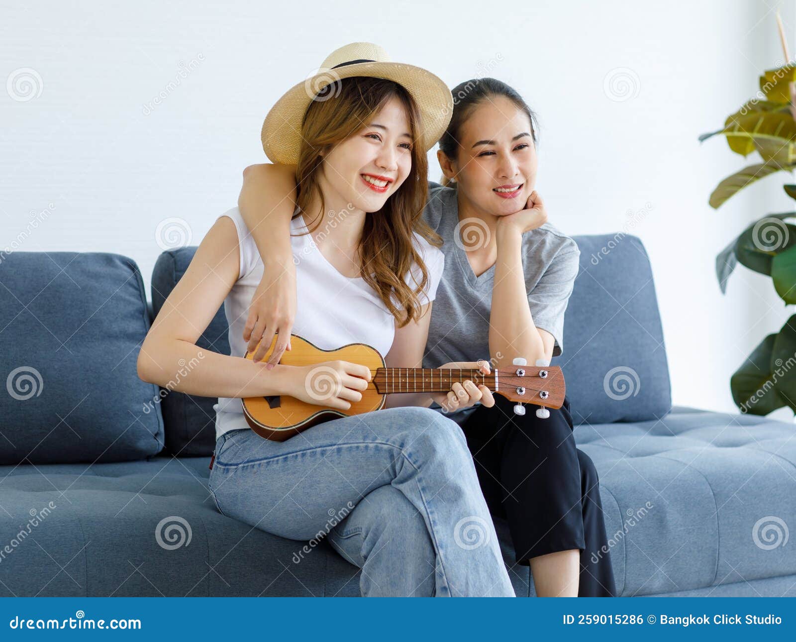 Millennial Asian Young Happy Female Lesbian Lgbtq Lover Couple Sitting