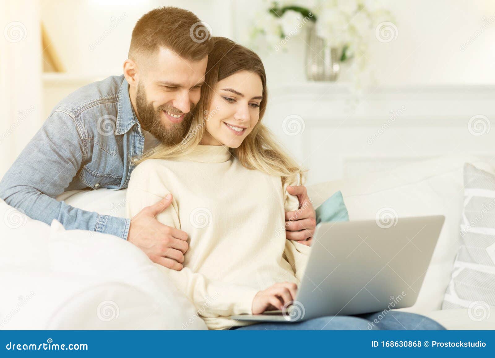 Millennial Couple Web Surfing on Laptop at Home Stock Photo - Image of ...