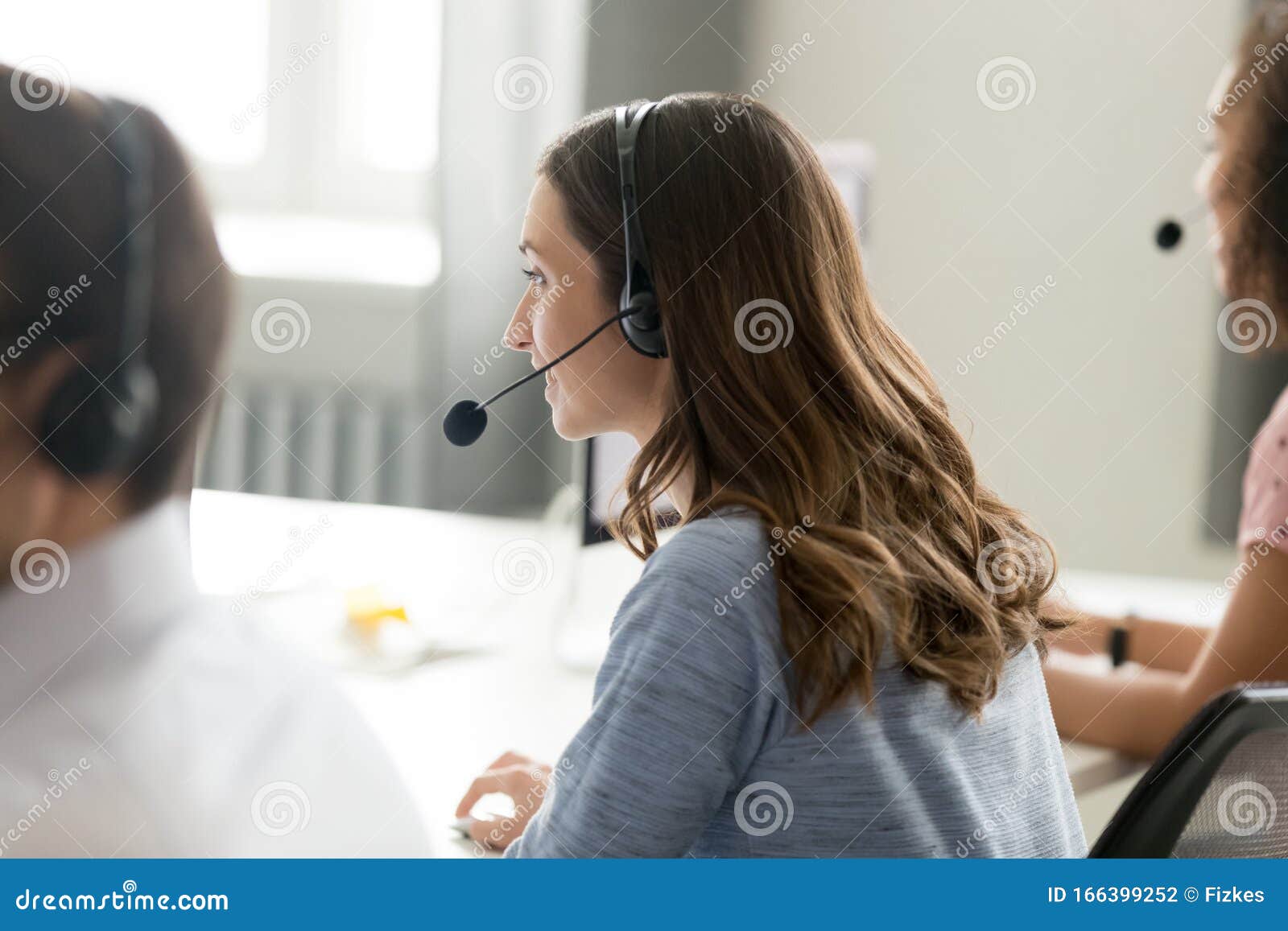 Millennial Female Employee in Headset Work in Shared Office Stock Photo ...