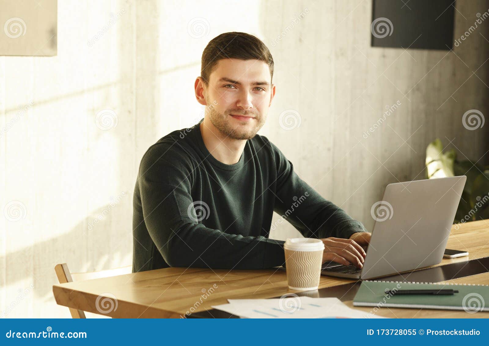 Millennial Guy at Laptop Posing Smiling at Camera in Office Stock Image ...